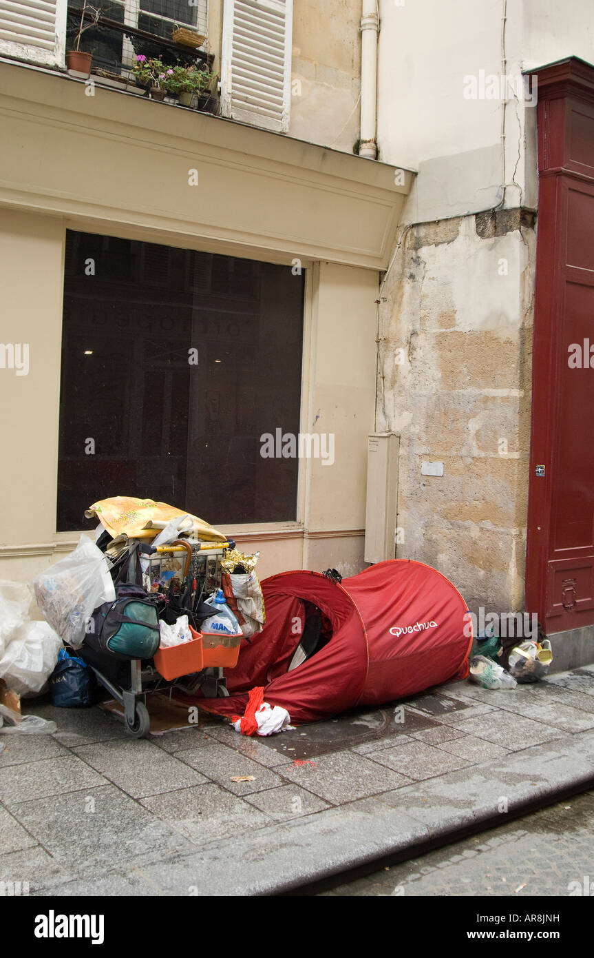 Homeless person living in a tent amongst all their belongings on a ...
