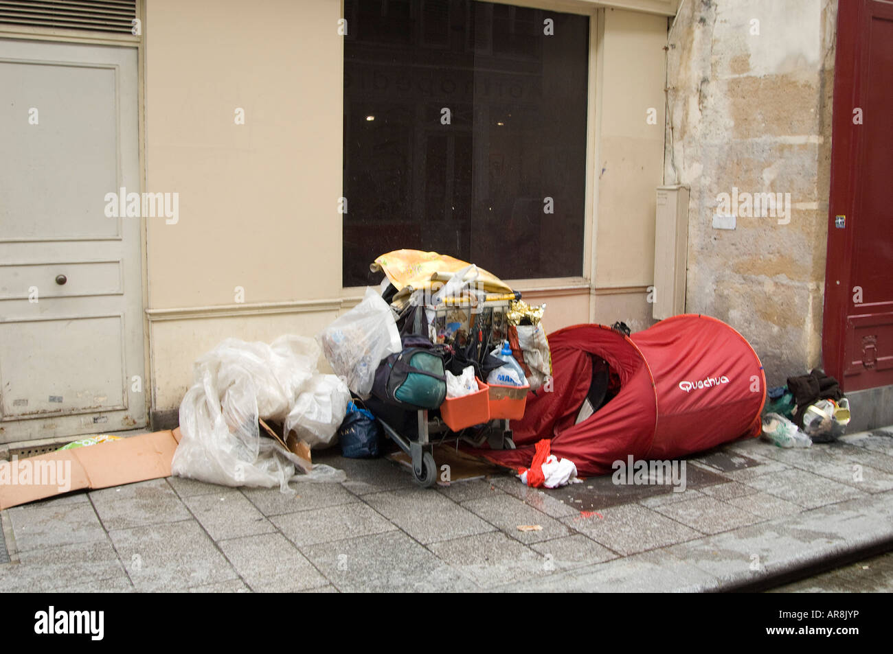 Homeless person living in a tent amongst all their belongings on a ...