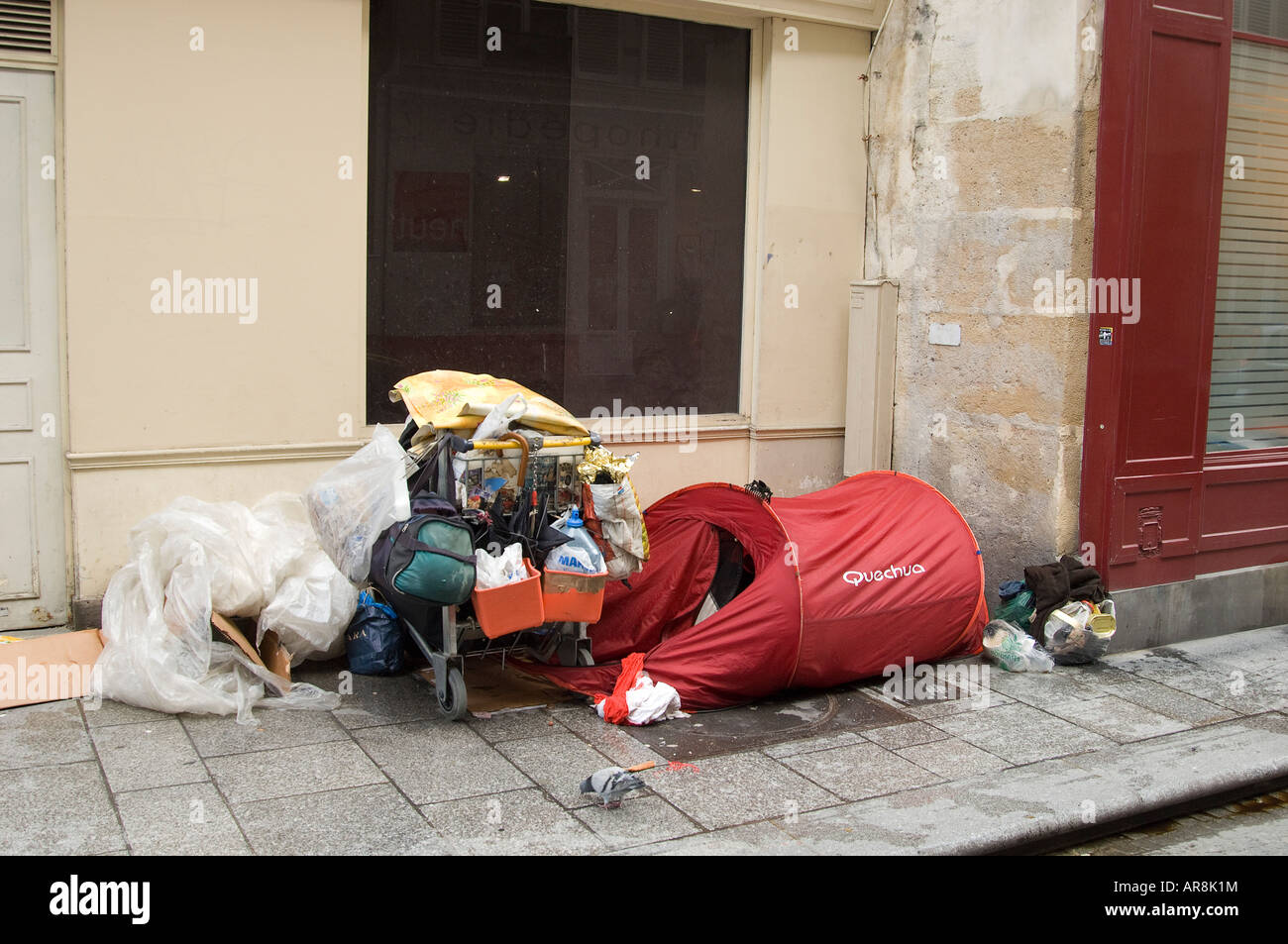 Homeless person living in a tent amongst all their belongings on a ...