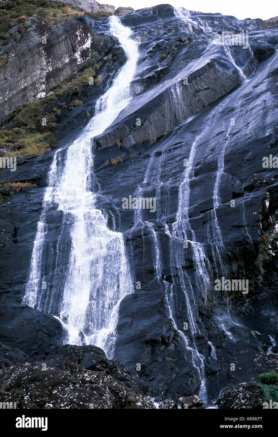 waterfall flowing over steep cliff in the irish landscape Stock Photo ...