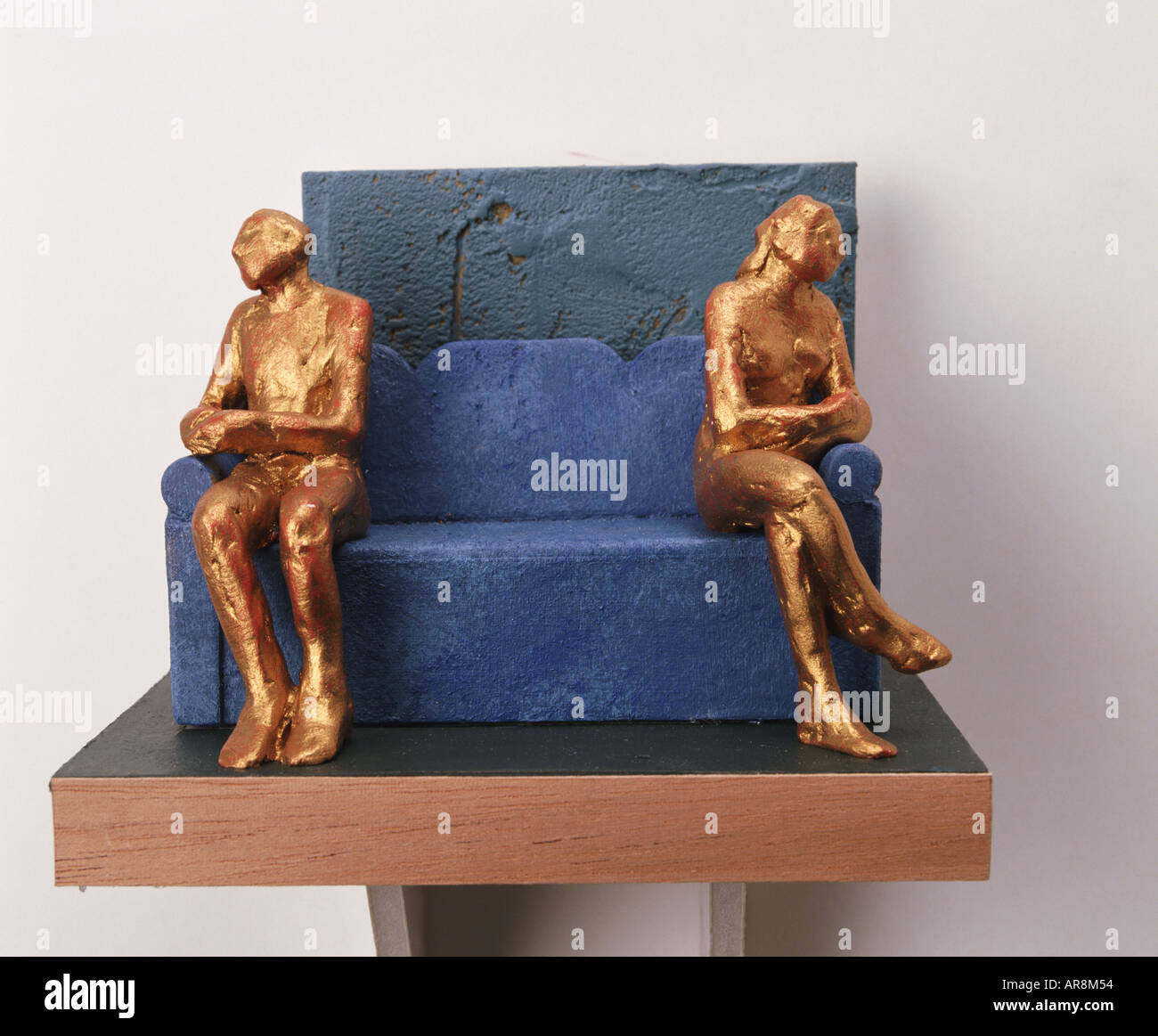 Golden sculpture woman sitting hi-res stock photography and images - Alamy