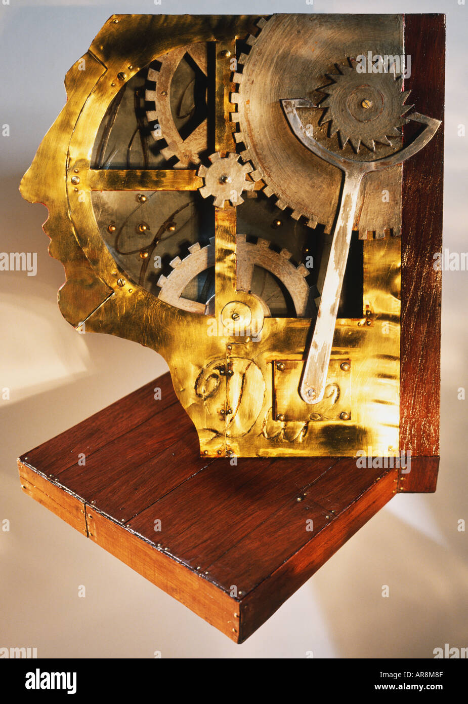 Metal face face made of clock mechanisms, interlocking cogs and levers ...