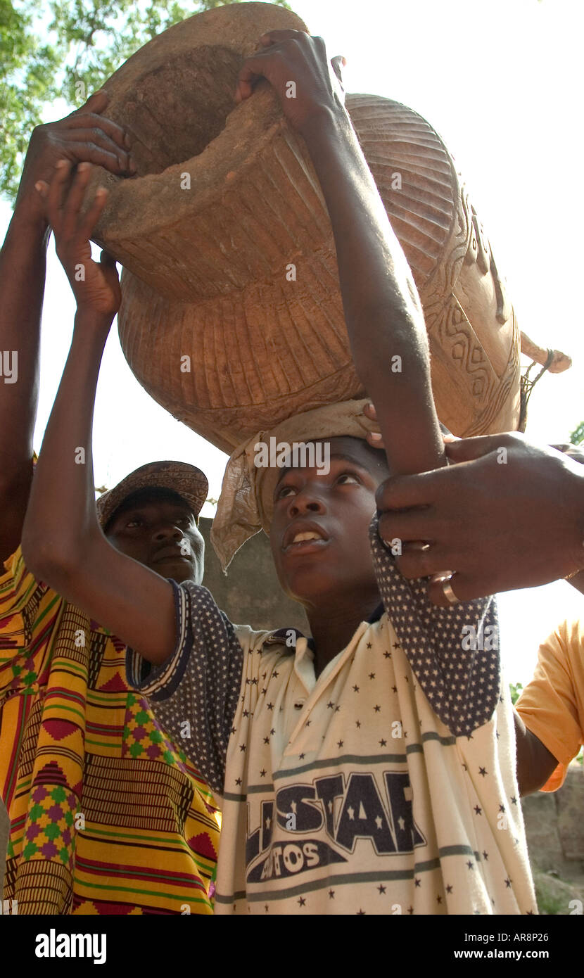Children carrying heavy load hi-res stock photography and images - Alamy
