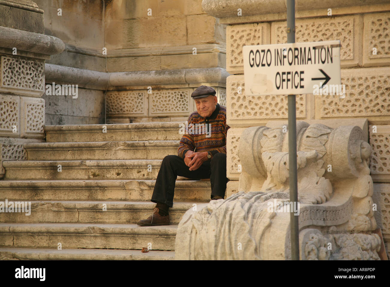 An old man sits on the steps in Valletta Malta Stock Photo - Alamy