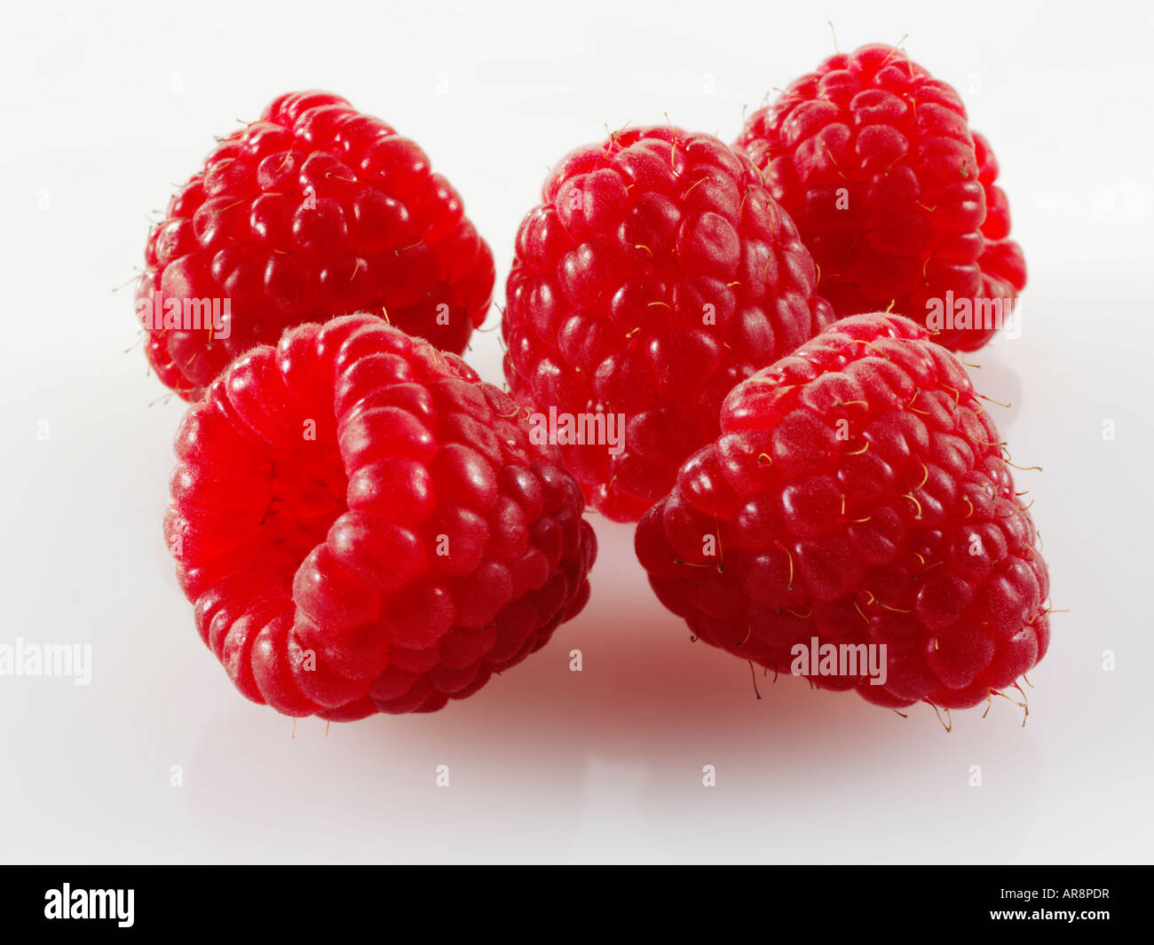 Organic fresh Raspberries on a white background Stock Photo - Alamy