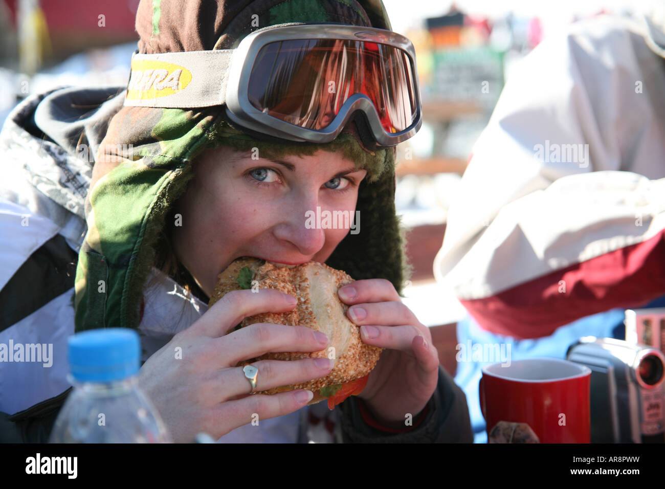 Girl eating junk food Stock Photo - Alamy