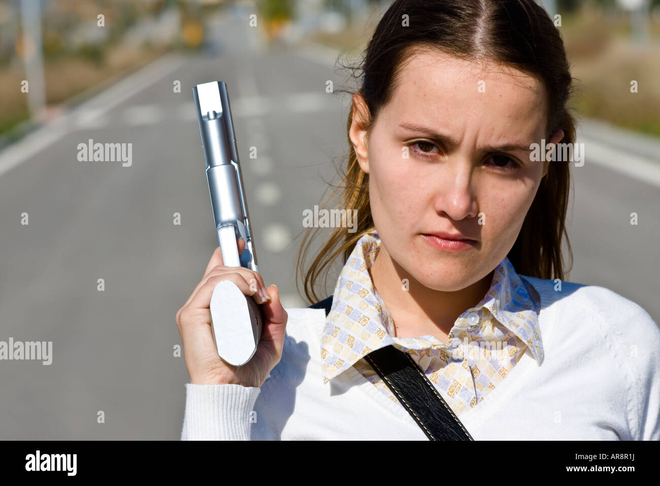 Young girl portrait with gun Stock Photo - Alamy