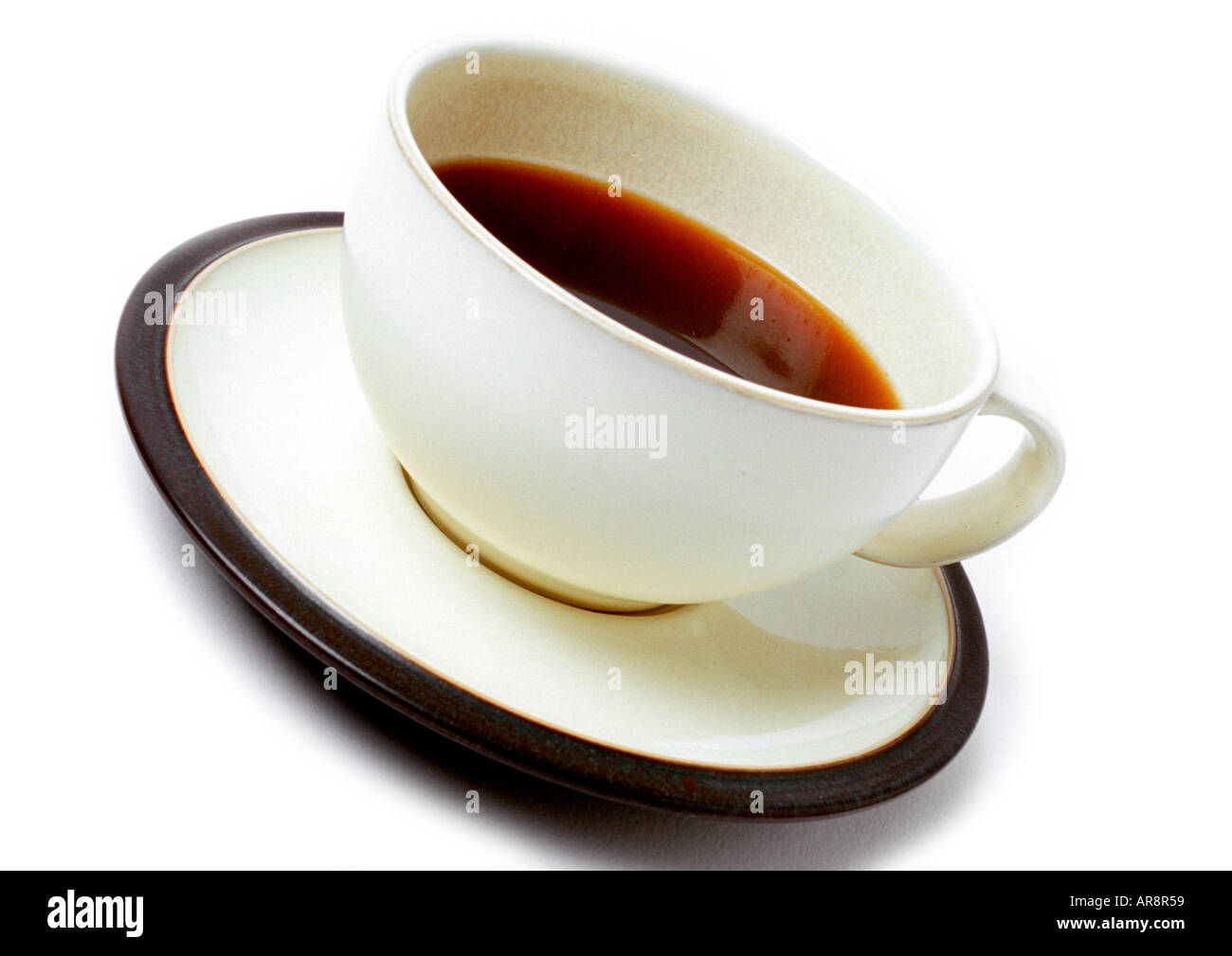 Cream coloured coffee cup and saucer on white background Stock Photo ...