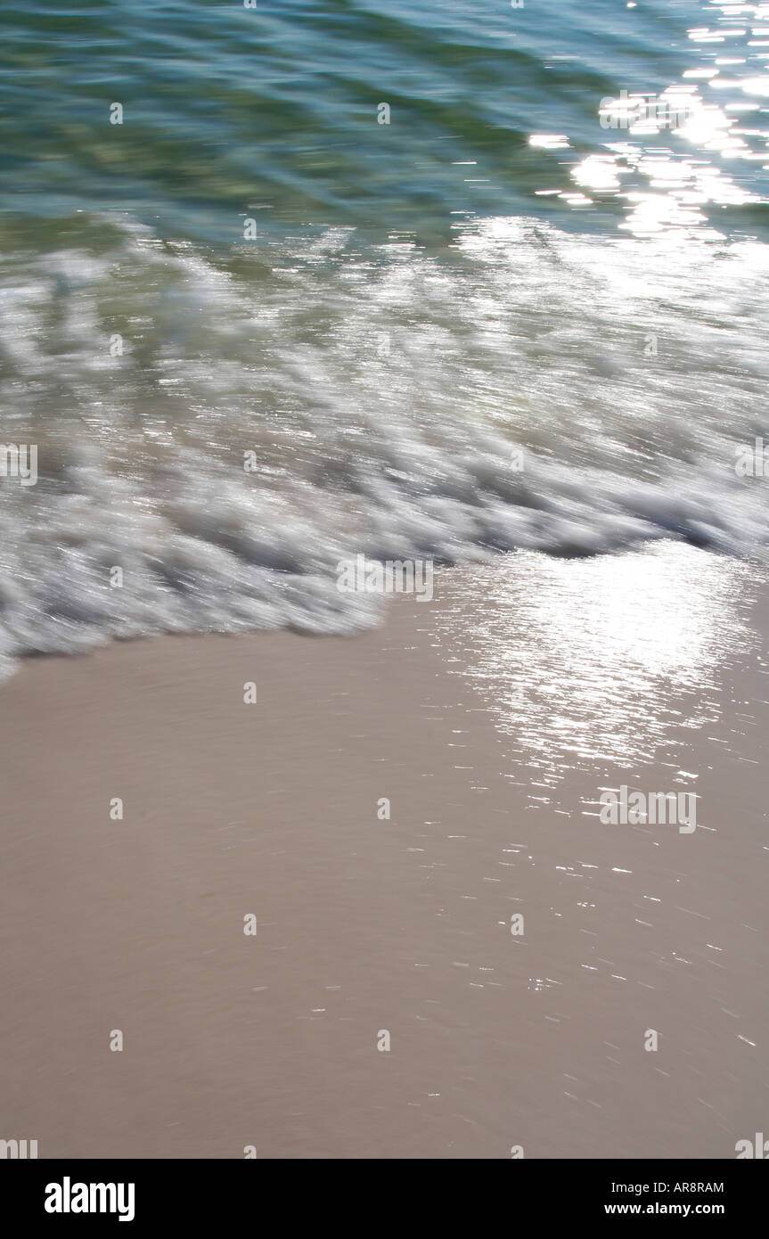 Waves on a beach in Florida close up Stock Photo - Alamy