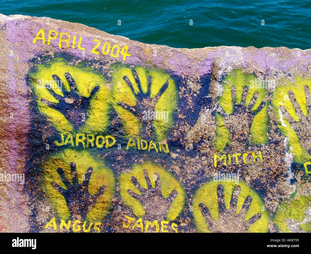 Graffiti and messages painted on the rocks at Nambucca Heads, New South ...