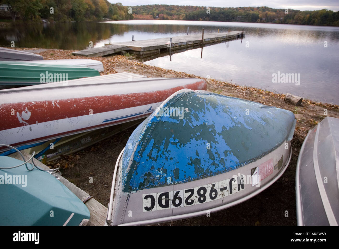 Boat hulls by the side of a lake Stock Photo - Alamy