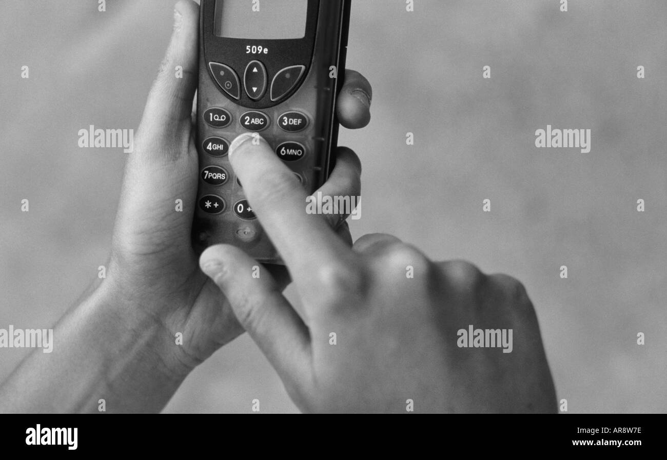 Cellular in hand black and white pictures B W Stock Photo - Alamy