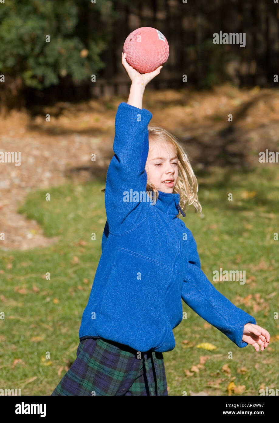 Child throwing a ball Stock Photo - Alamy