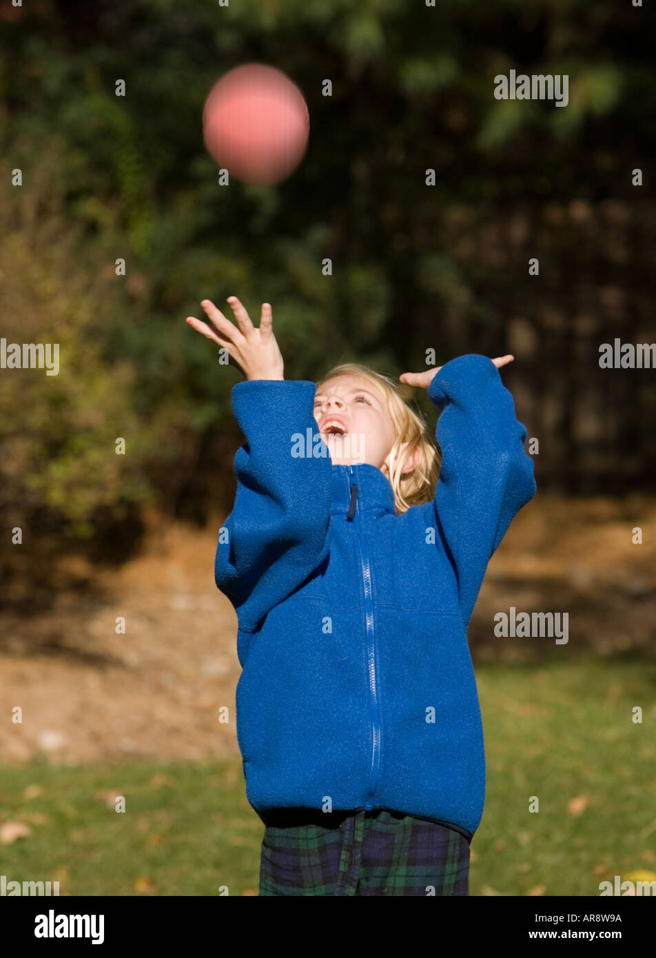 Child throwing a ball Stock Photo - Alamy