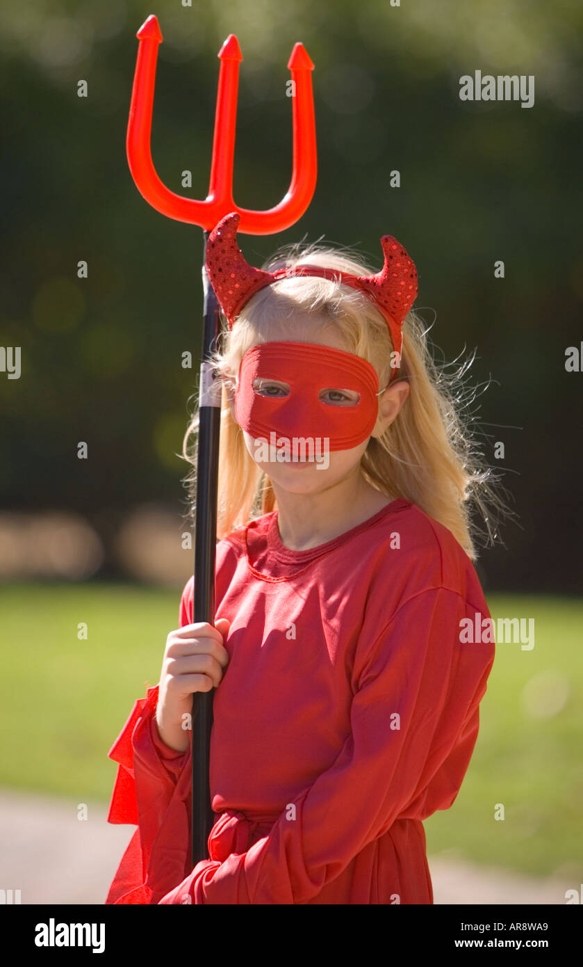 Child dressed in a devil costume for Halloween Stock Photo - Alamy