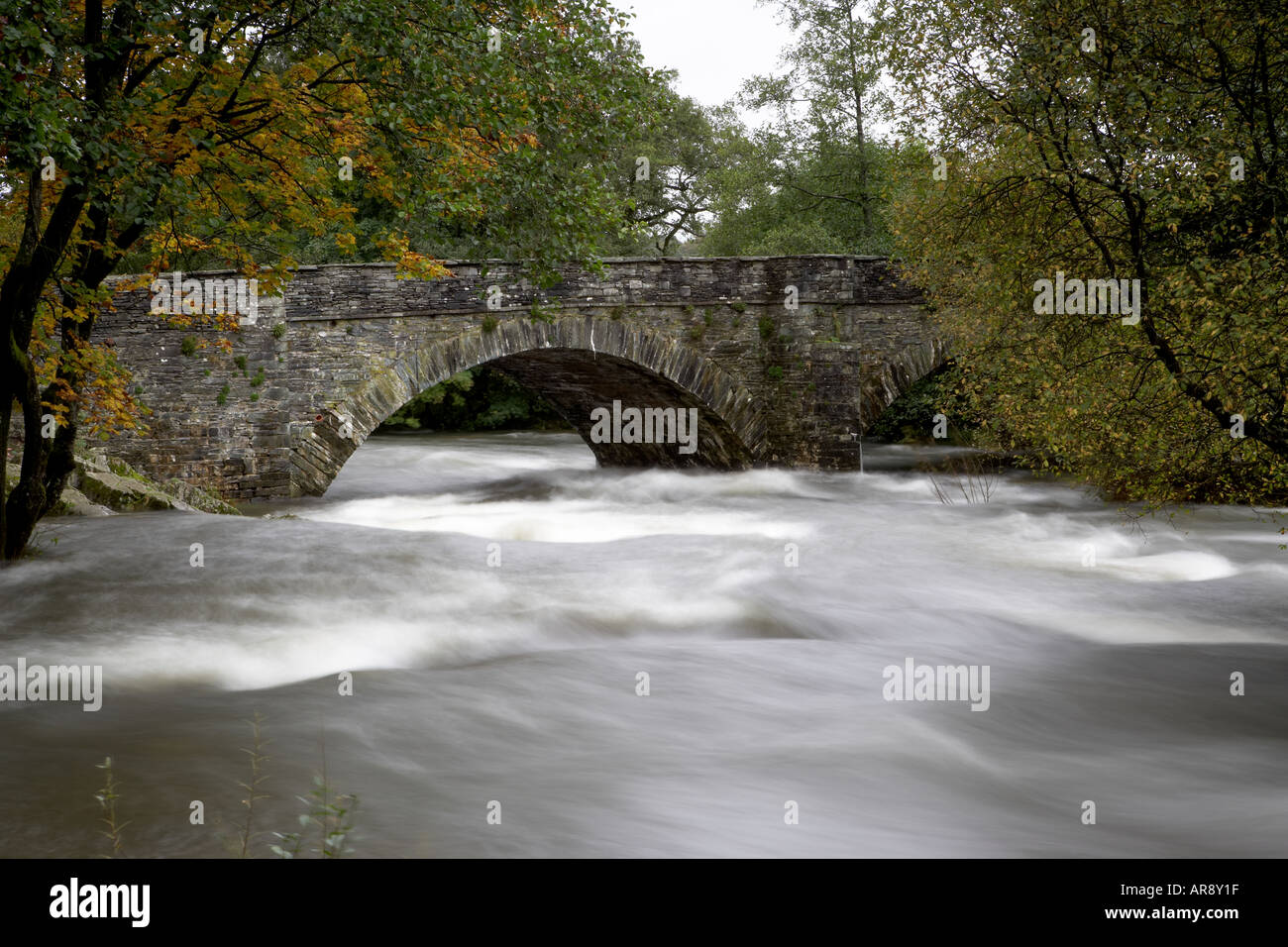 Autumn flood water at Skelwith Bridge in the Lake District, Cumbria, UK ...