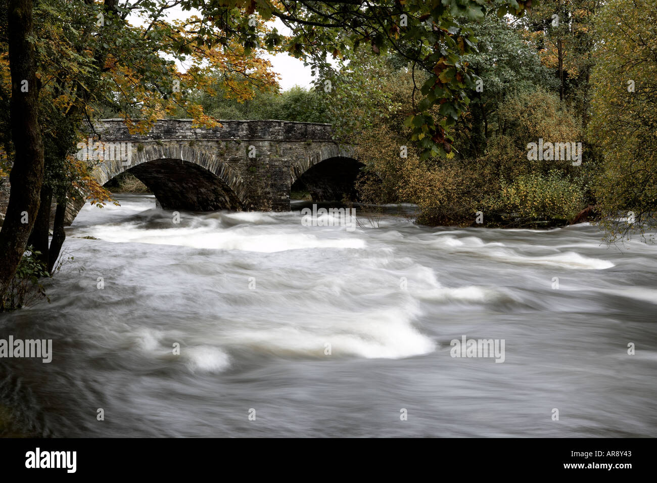 Autumn flood water at Skelwith Bridge in the Lake District, Cumbria, UK ...