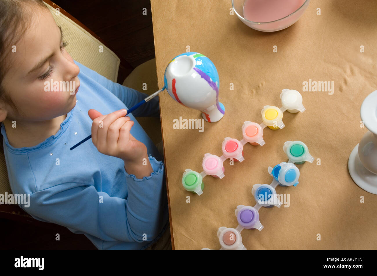 Little girl painting pottery Stock Photo - Alamy