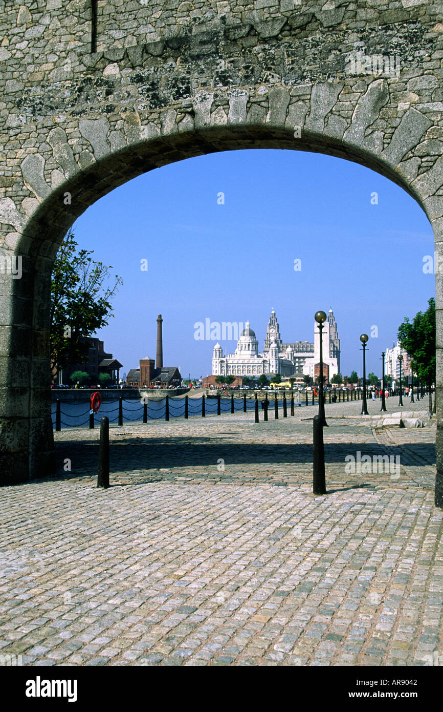 Stone archway in Albert Dock with the Liver and Port of Liverpool ...