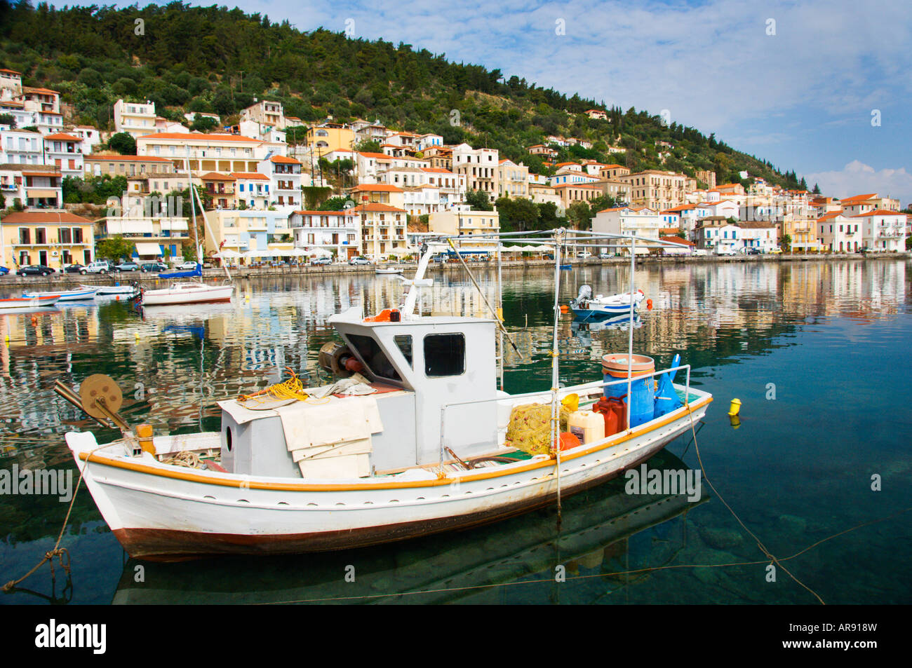 Pastel colored buildings on the waterfront and colorful fishing boats ...