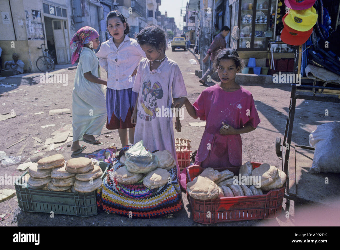 Children sell bread on an Aswan street Stock Photo - Alamy