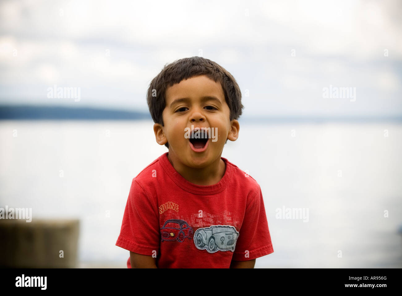 Young silly boy playing Stock Photo - Alamy