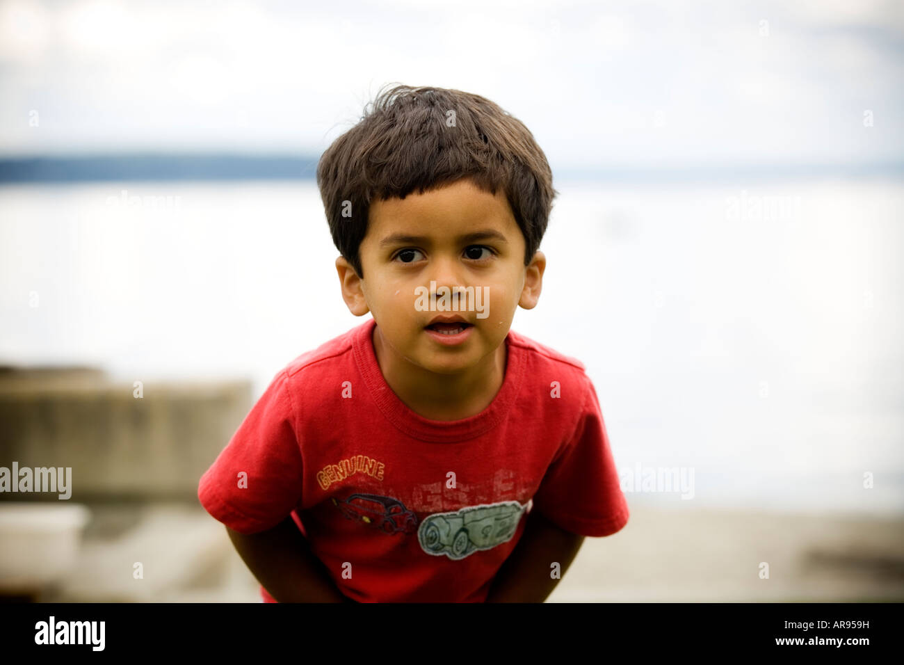 Young silly boy playing on beach Stock Photo - Alamy