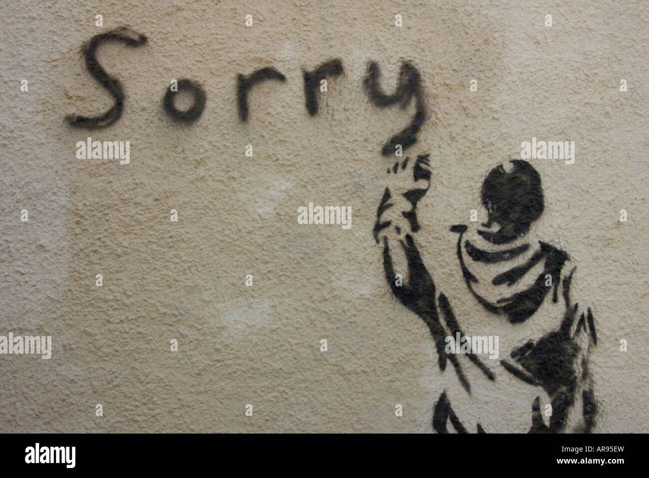 graffiti depicting graffiti artist painting the word "sorry" in the ...