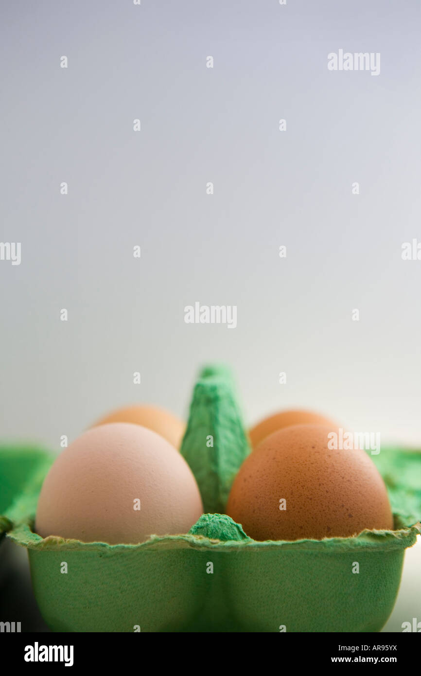 Green Egg Box with four Eggs Stock Photo - Alamy
