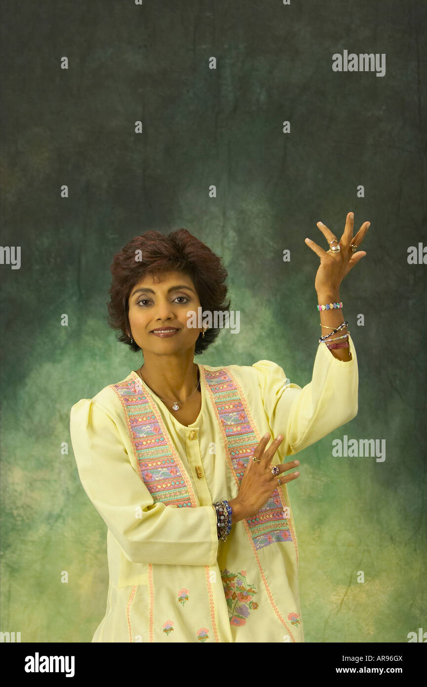 An Indian woman in yellow traditional ethnic dress Stock Photo - Alamy