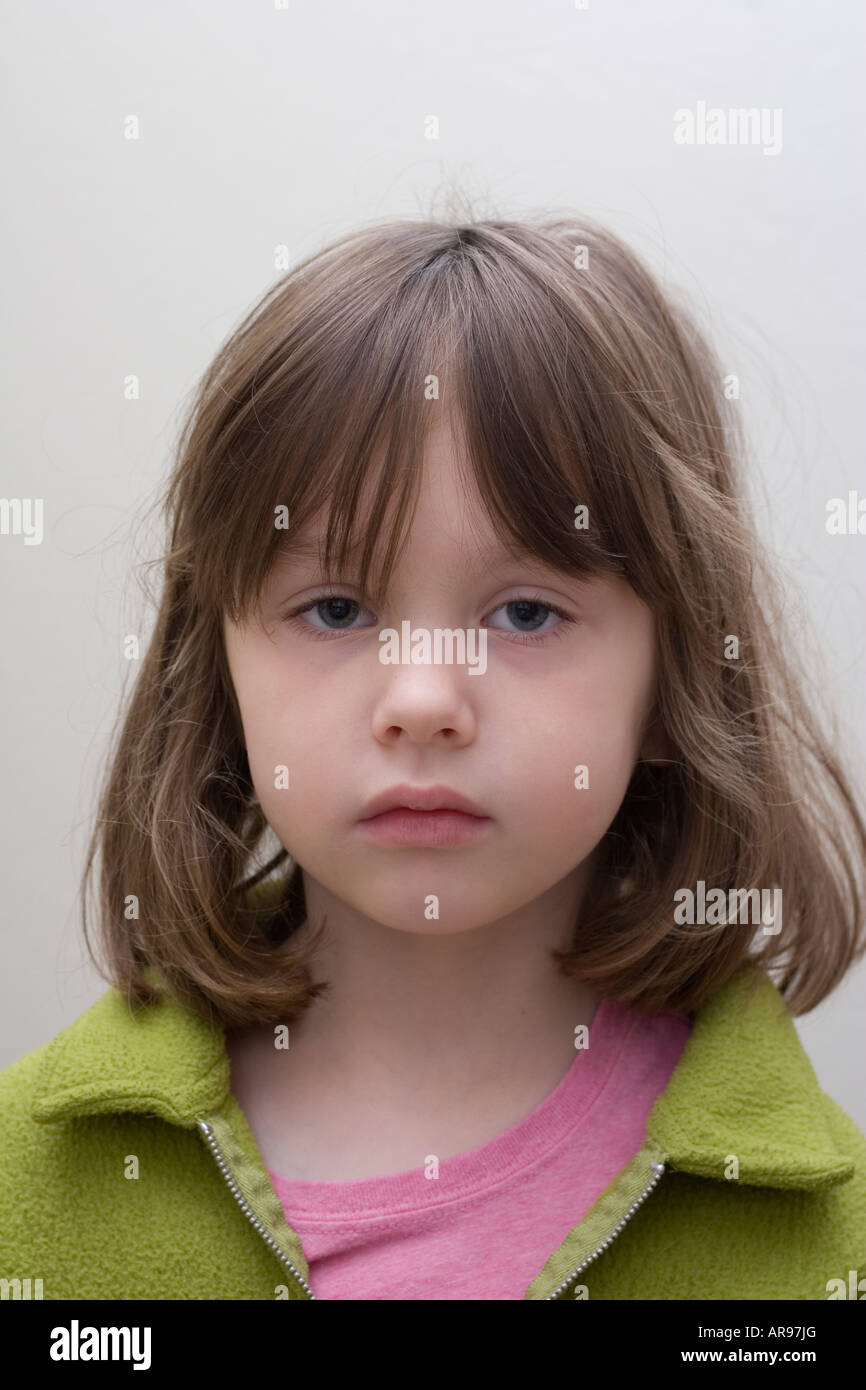 Young girl looking toward camera Stock Photo - Alamy