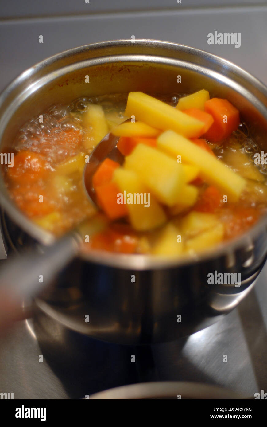 boiling vegetables in a pan, fresh veg, healthy eating Stock Photo - Alamy