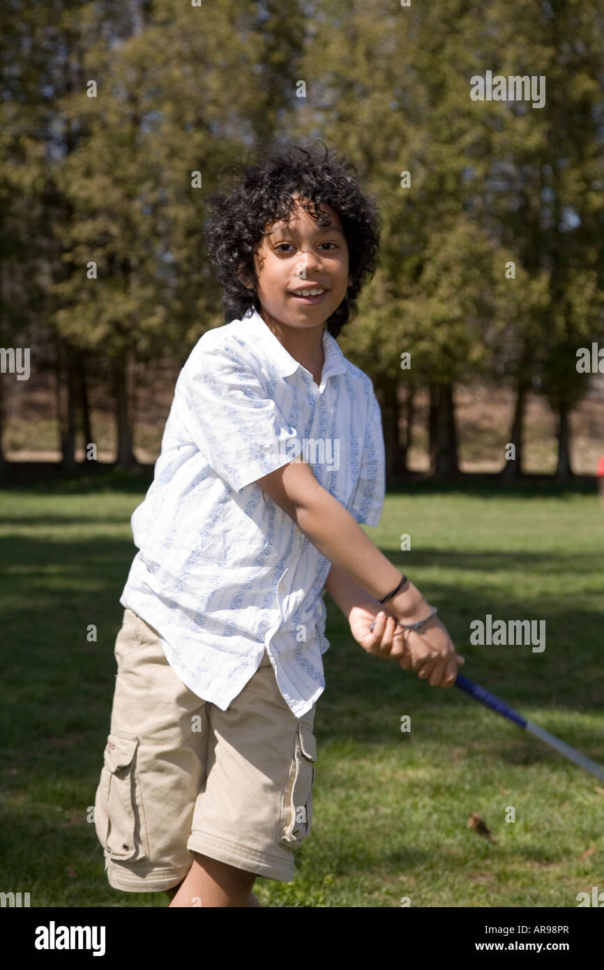 Young Asian boy playing golf Stock Photo - Alamy