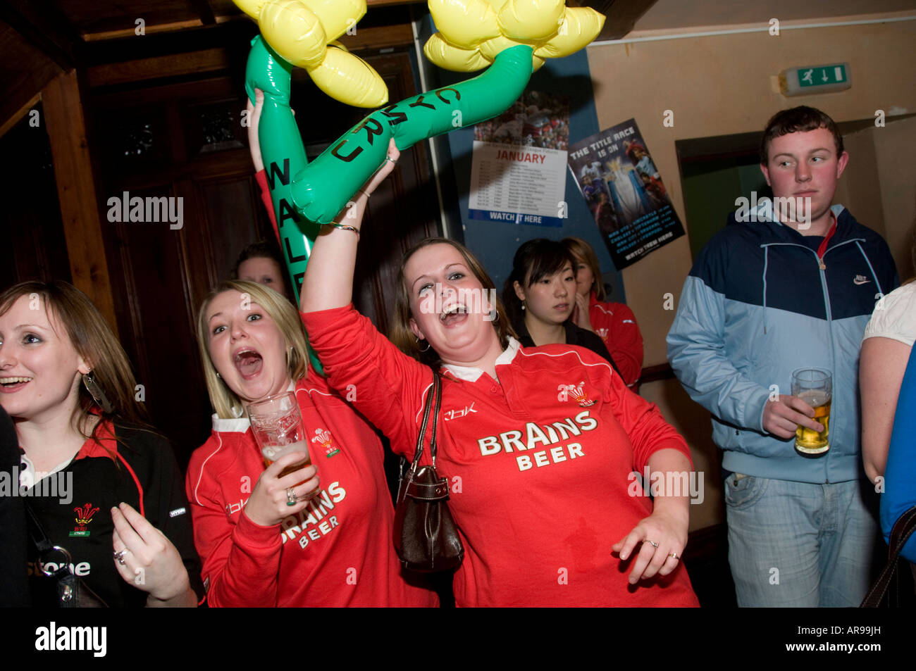 Two women supporters of the welsh rugby team celebrating the their side ...