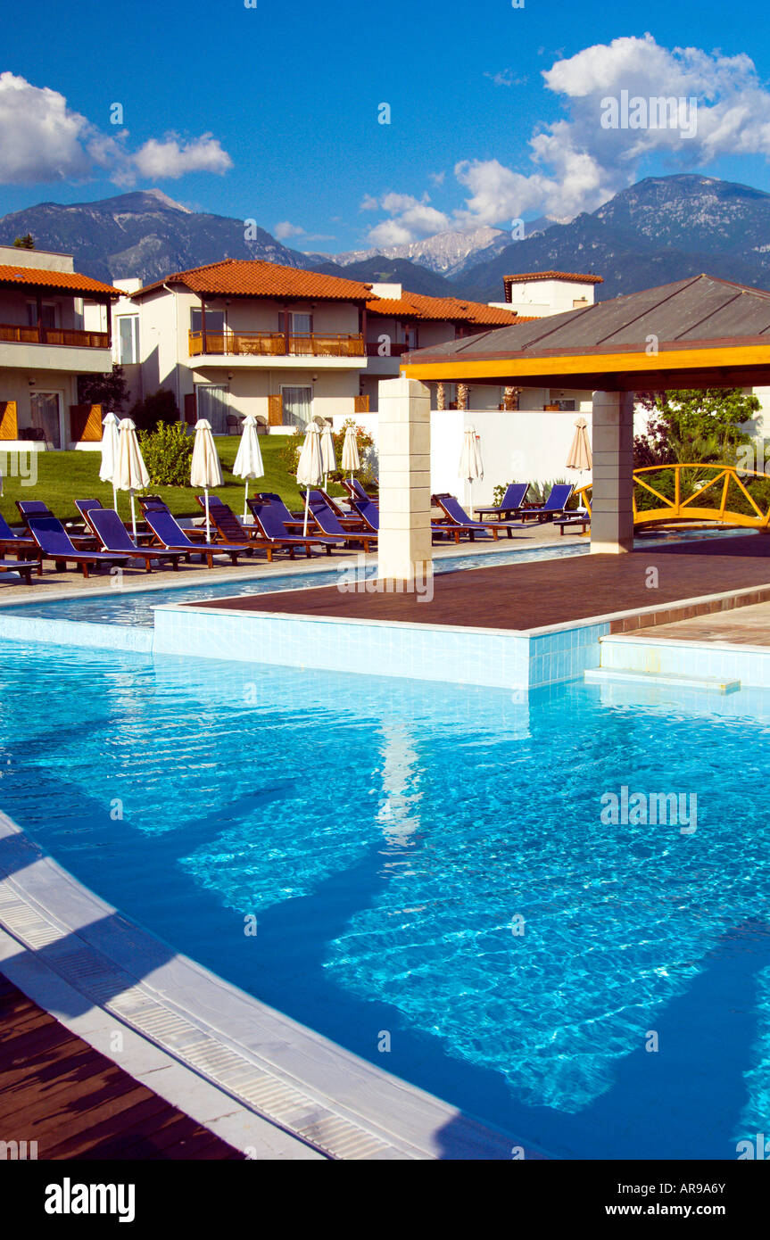Pool area with blue lounge chairs at the Dion Palace Resort in Litohor ...
