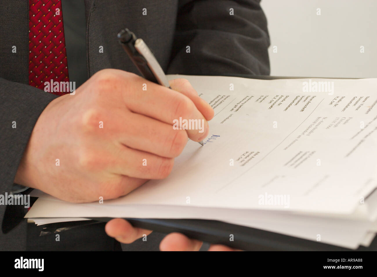 Male hand writing Stock Photo - Alamy