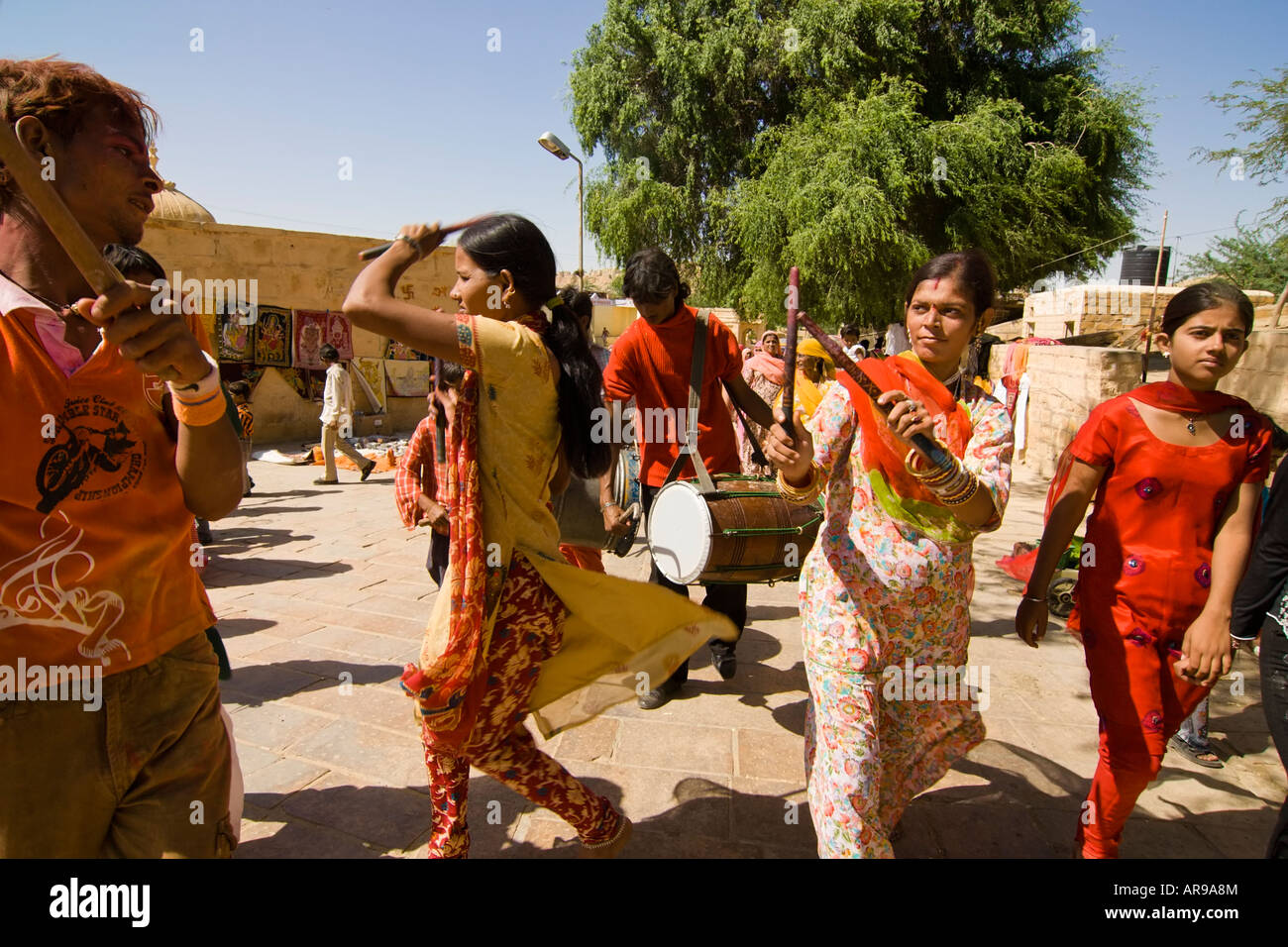 Indian people dancing in the street and playing music during Kali ...