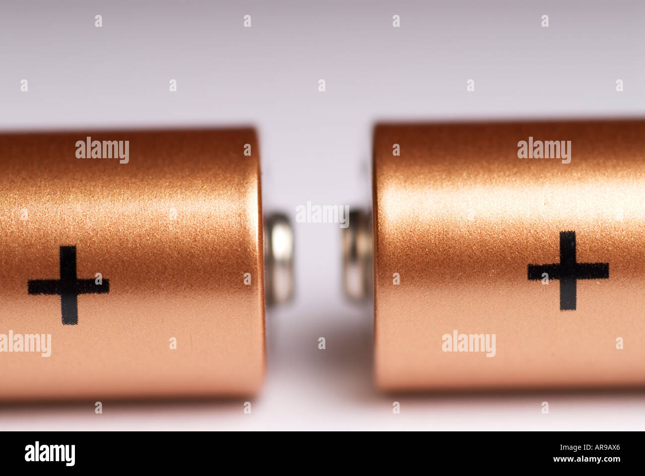 Image of the positive contacts of small batteries Stock Photo - Alamy