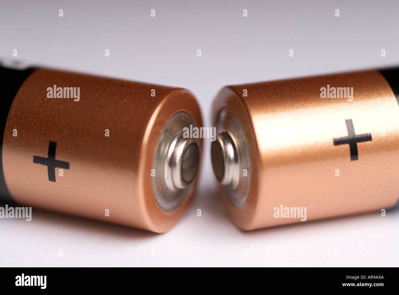 Image of the positive contacts of small batteries Stock Photo - Alamy