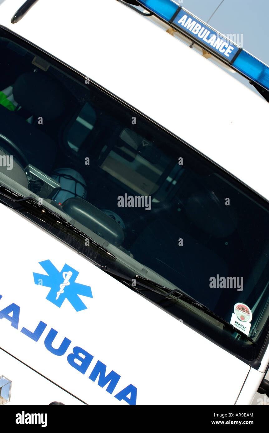 a front view of an ambulance emergency vehicle on an angle making a ...