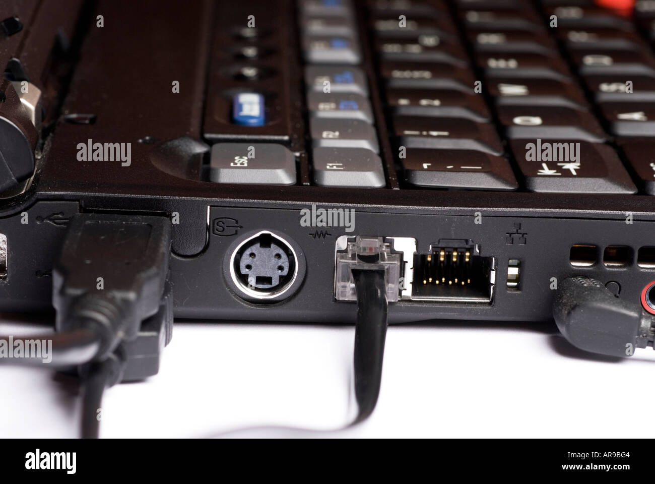 Image of the side view of a laptop computer showing the various plugs ...