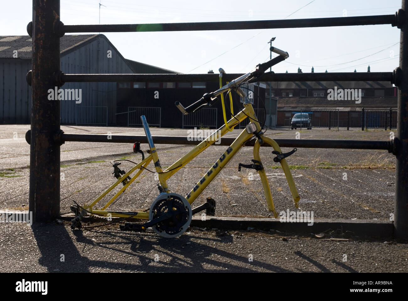 Image of the frame of a bike chained to railings Stock Photo - Alamy