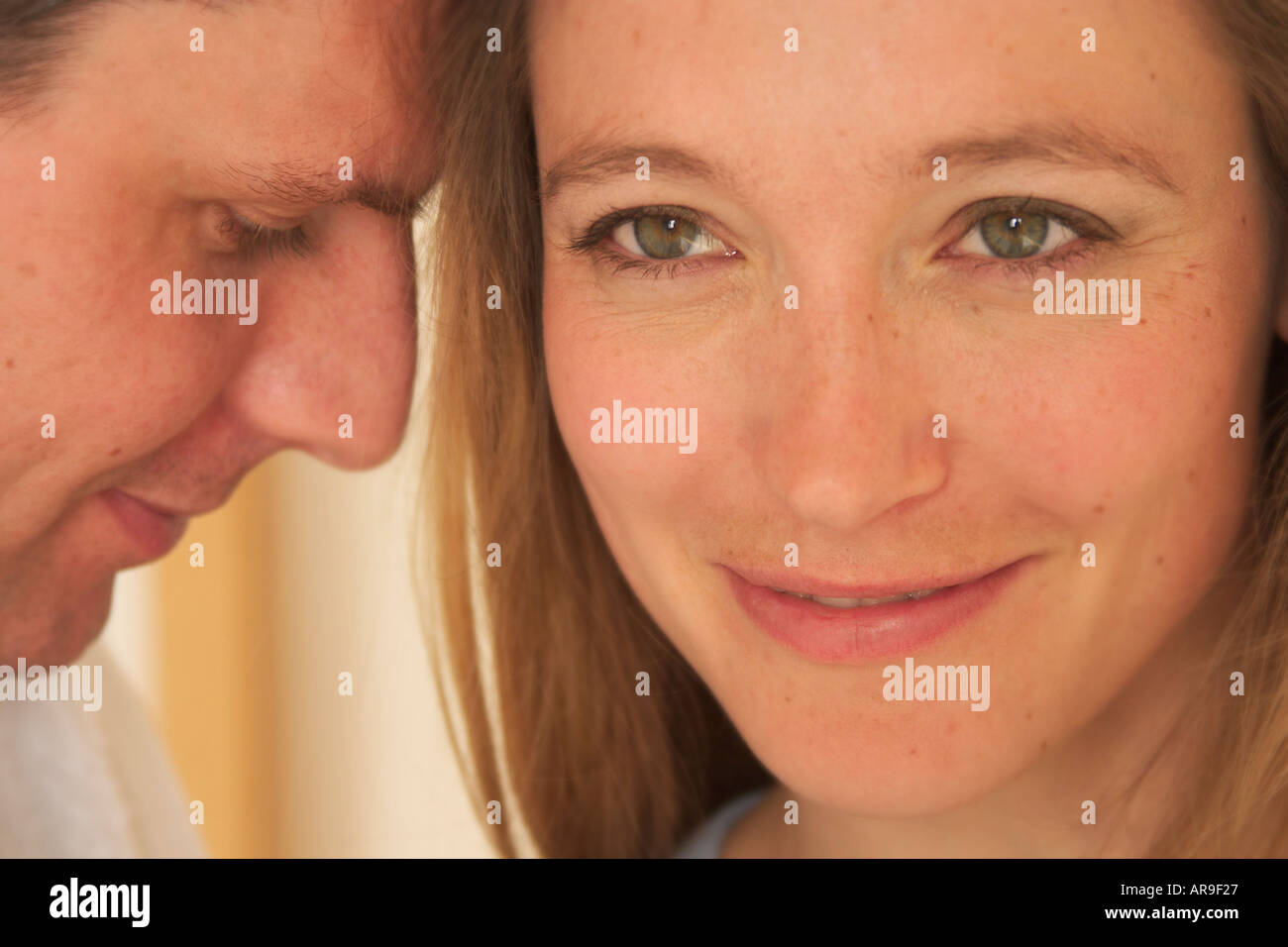 Man leans his forehead tenderly against the face of his partner Stock ...