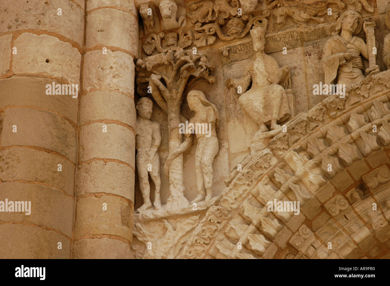 Stone carvings on the cathedral at Poitiers depict Adam and Eve and the ...