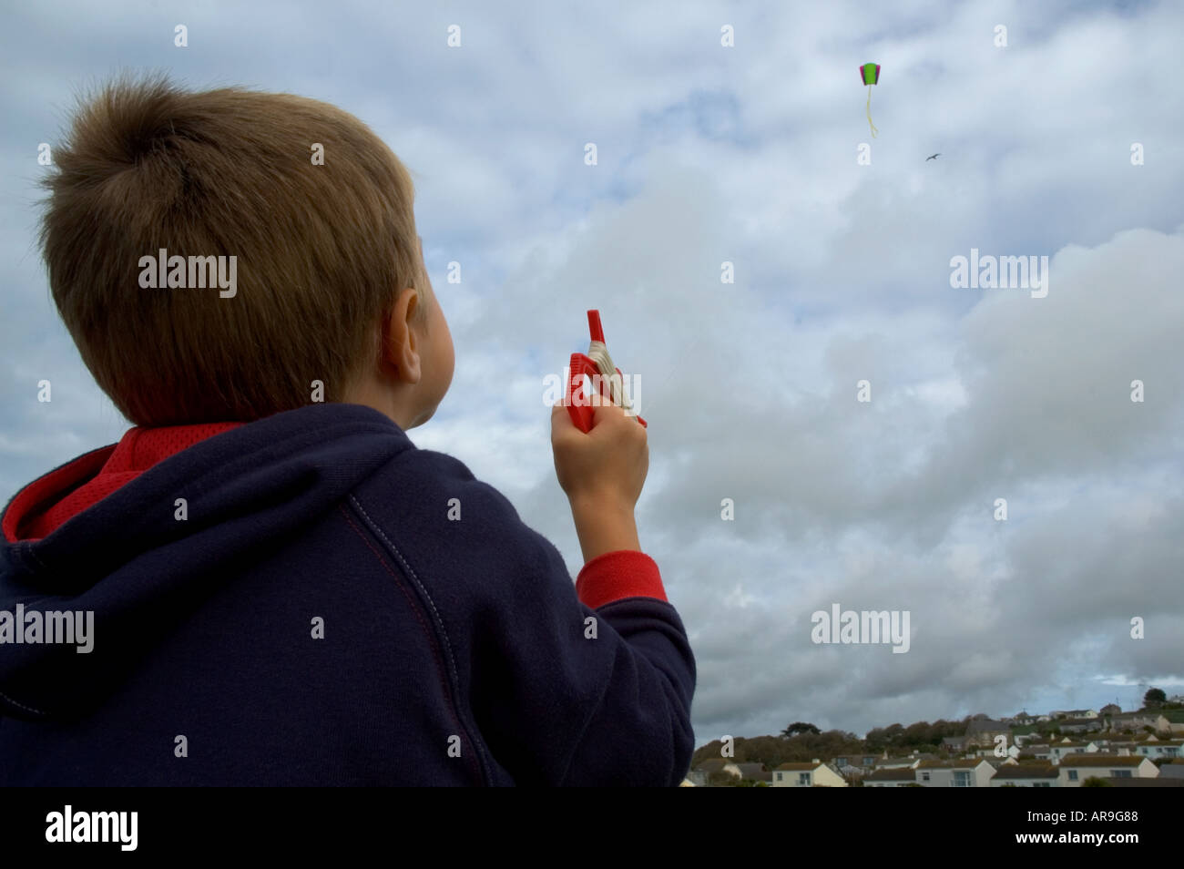 A young boy flying his kite Stock Photo - Alamy