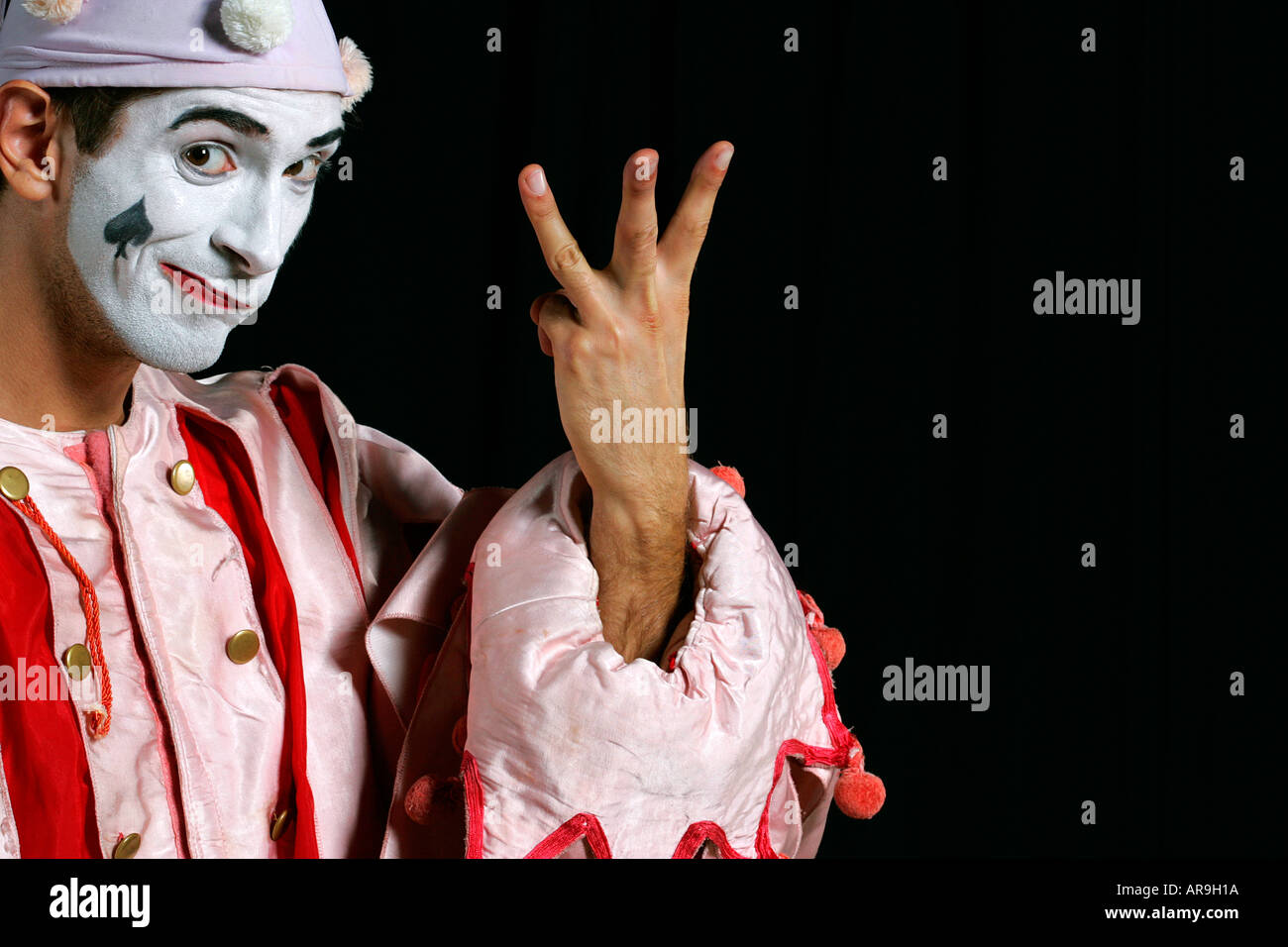 three fingers show joker actor comedian comedy hat color colour costume ...