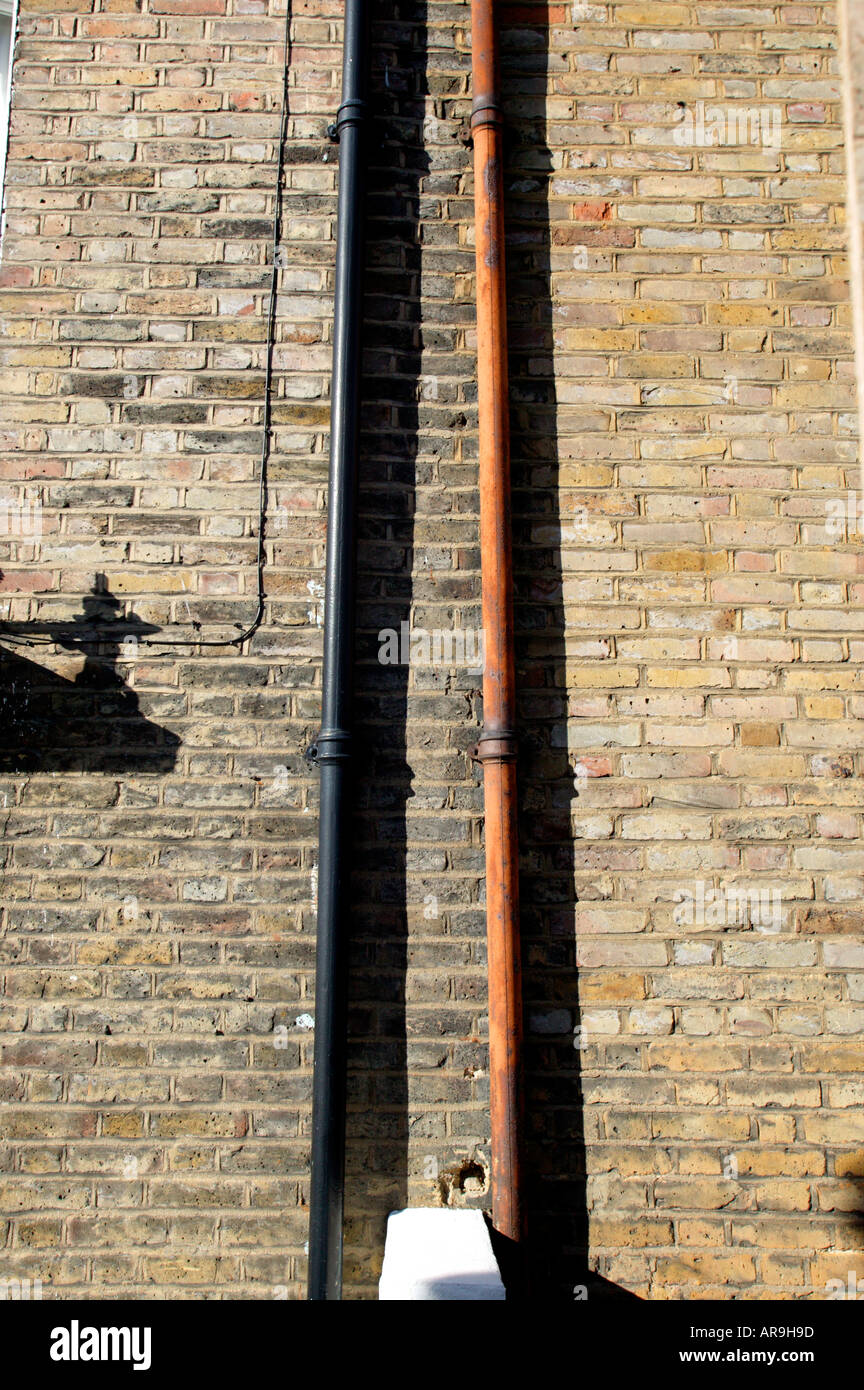 Old and New Down Pipes on a house in london Stock Photo - Alamy