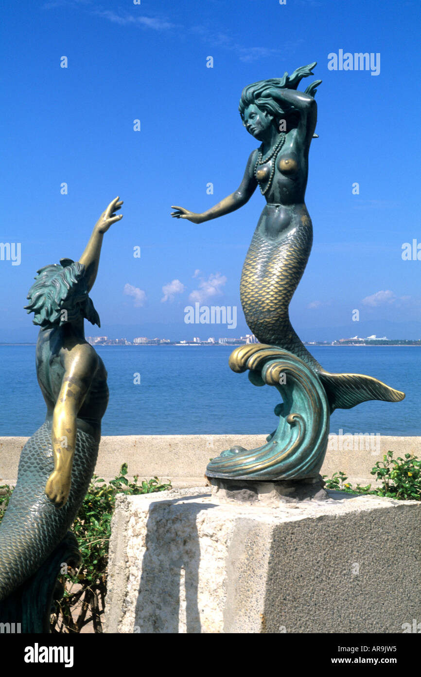 Statues of bronze mermaids on the beach in Puerto Vallarta Mexico Stock ...