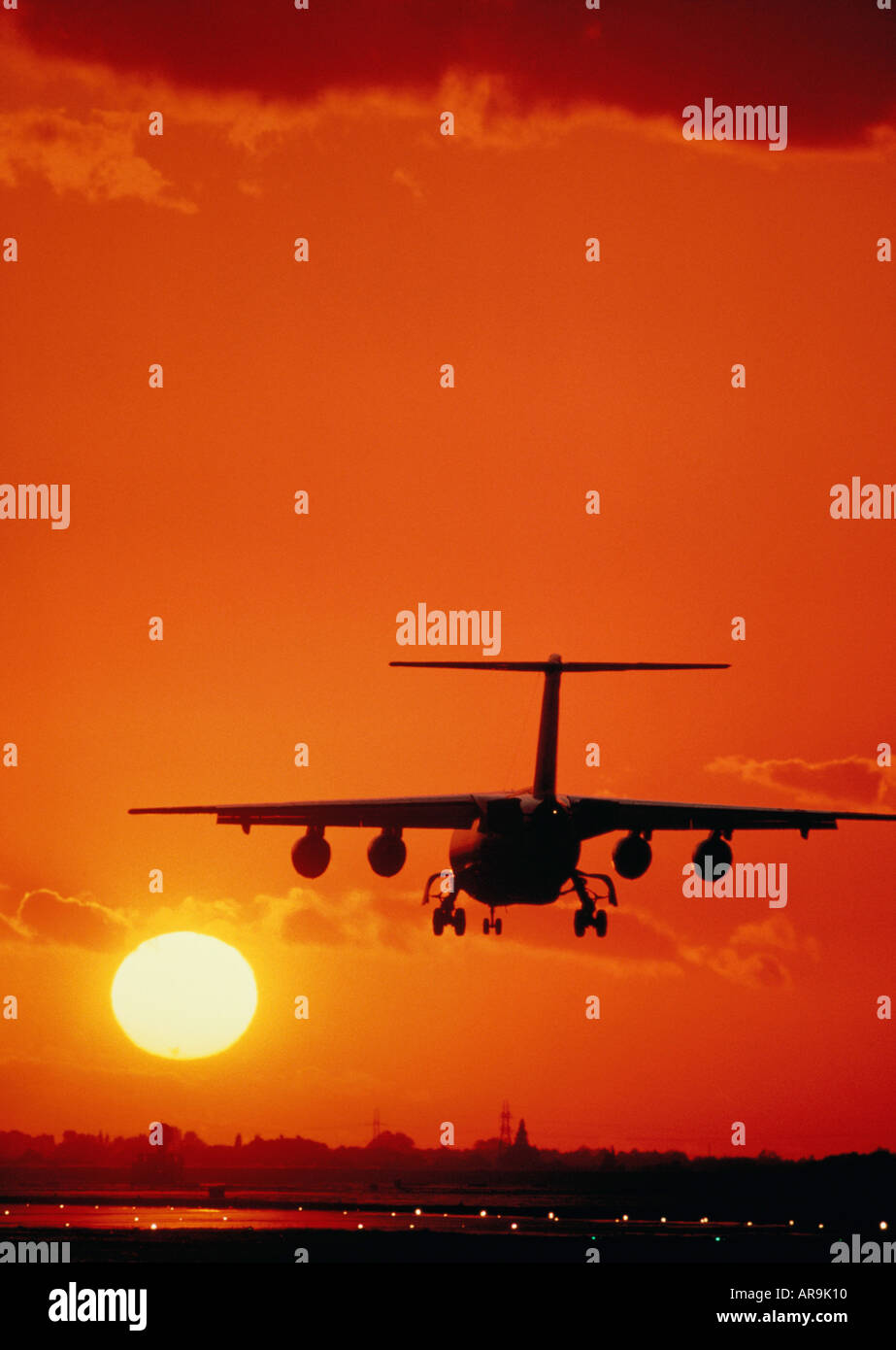 BAE Avro Regional Jet RJ 146 flying runway lights heading into an ...