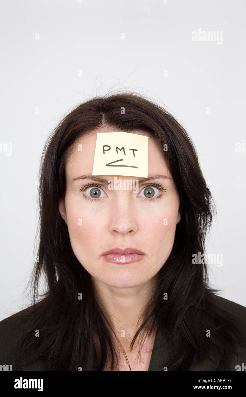 woman with post it note on her head with PMT Stock Photo - Alamy